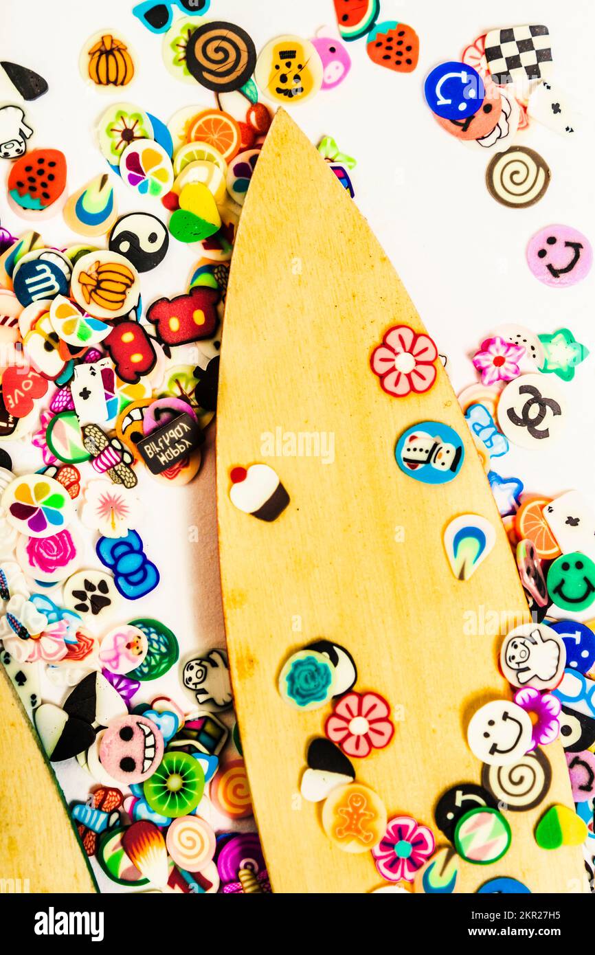 Colourful object art with carved surfboards and random surf decals ...