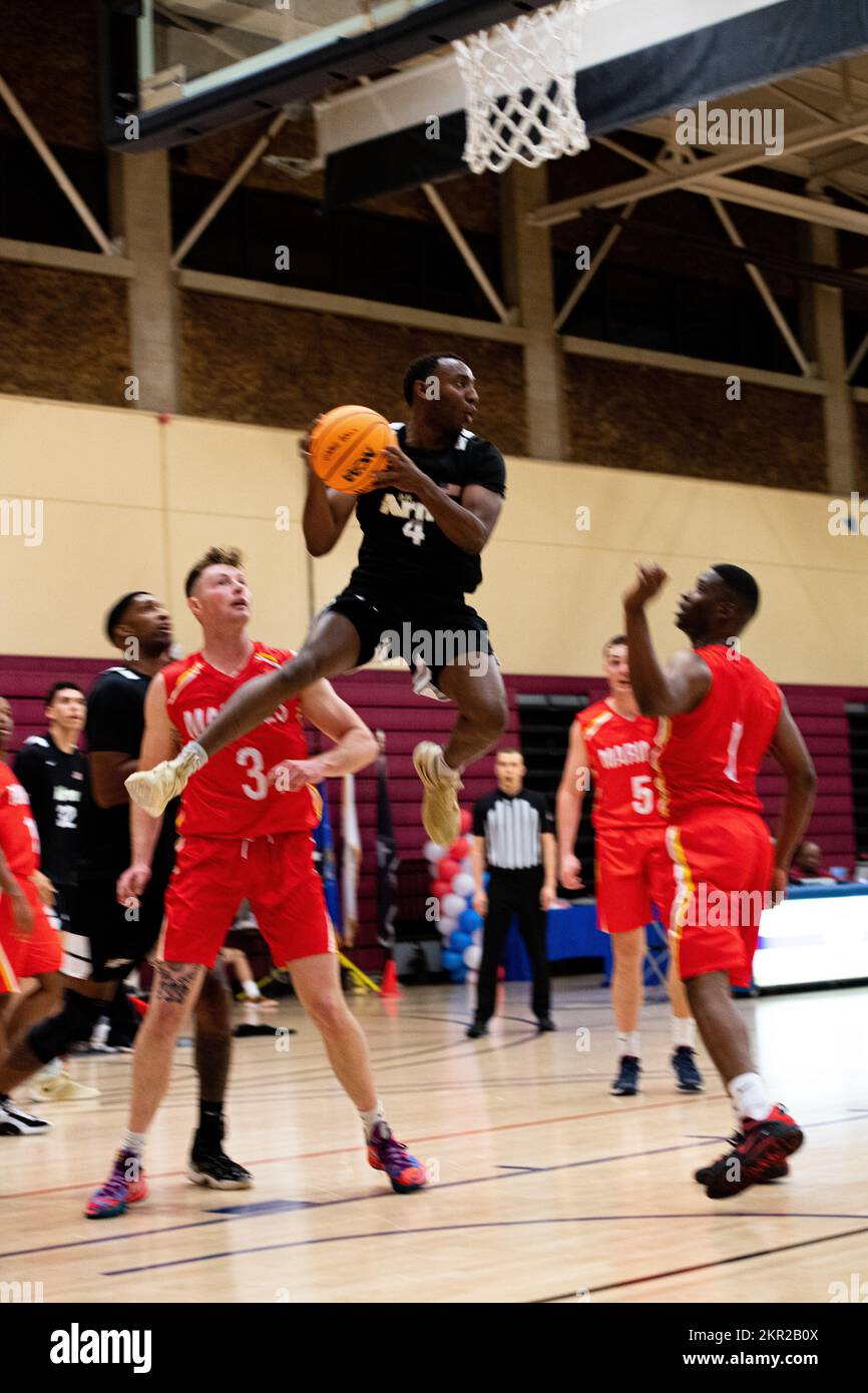 U.S. Army 2nd Lt. Lonnie Grayson, a member of team Army, makes a pass ...