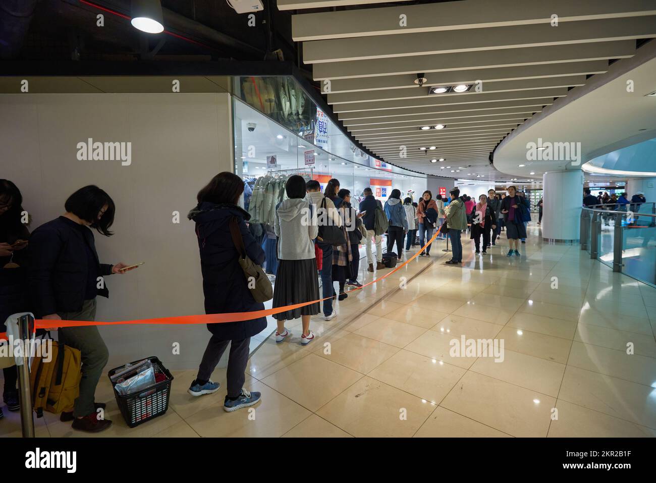 HONG KONG - CIRCA DECEMBER, 2019: people staying in queue at Uniqlo ...