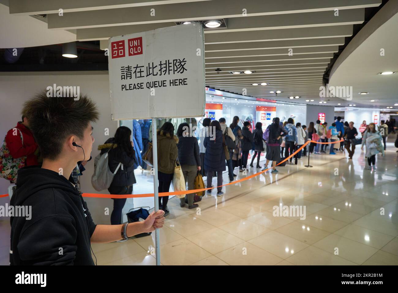 HONG KONG - CIRCA DECEMBER, 2019: people staying in queue at Uniqlo ...