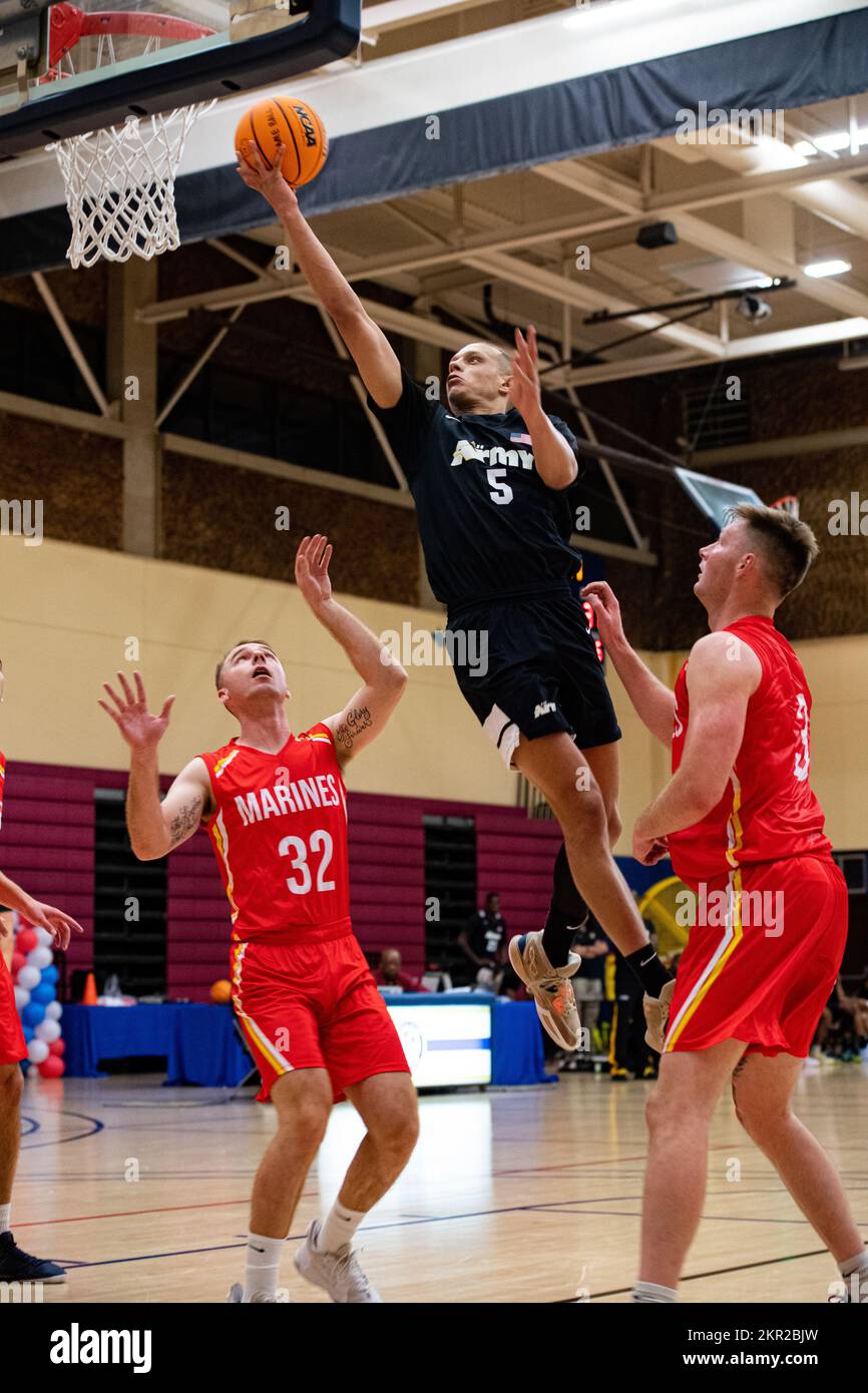 U.S. Army 2nd Lt. Colton Ray, a member of team Army, attempts a layup ...