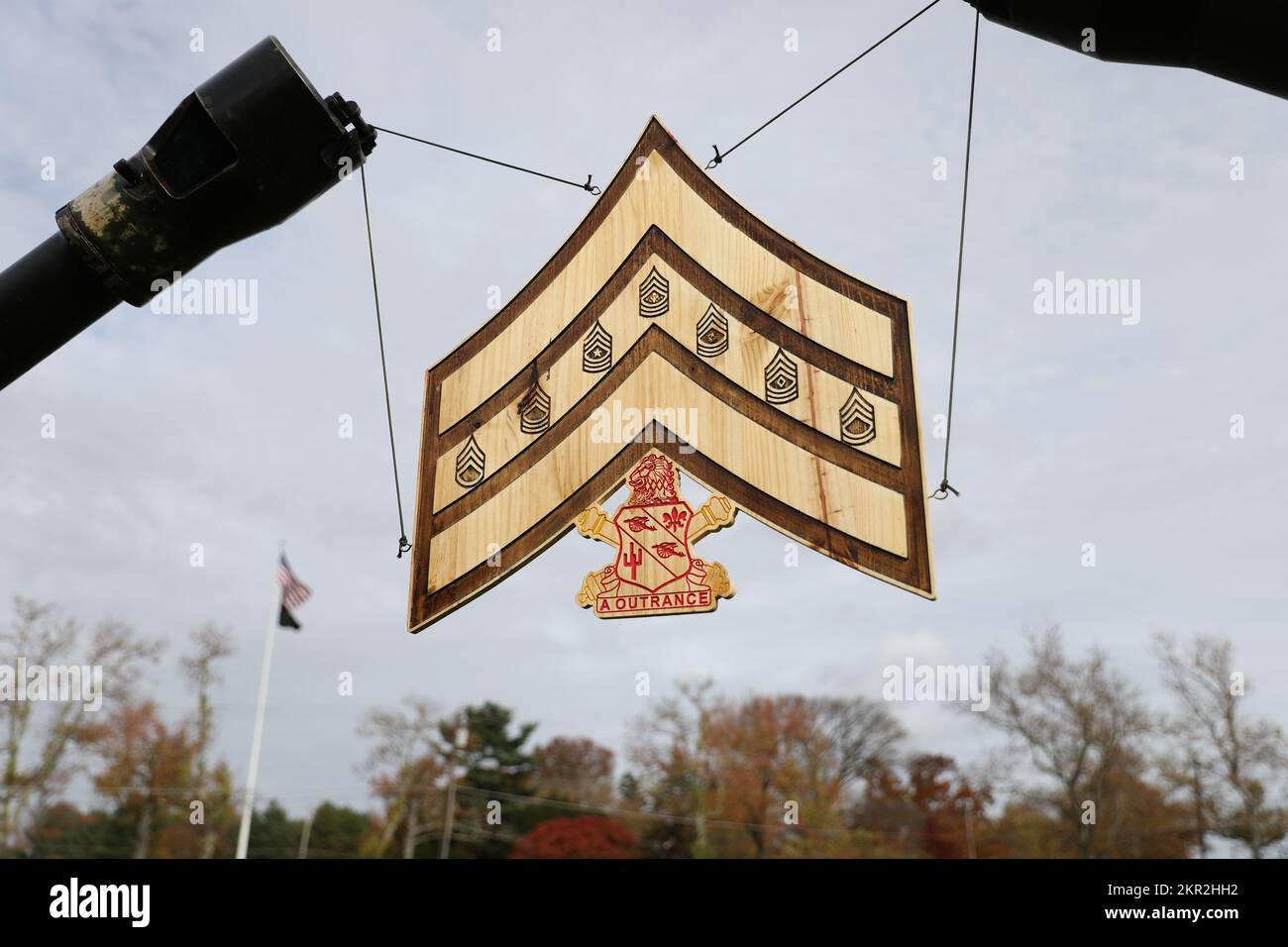 A chevron hangs from M119A3 Howitzers during a change of responsibility ceremony of 3rd ...