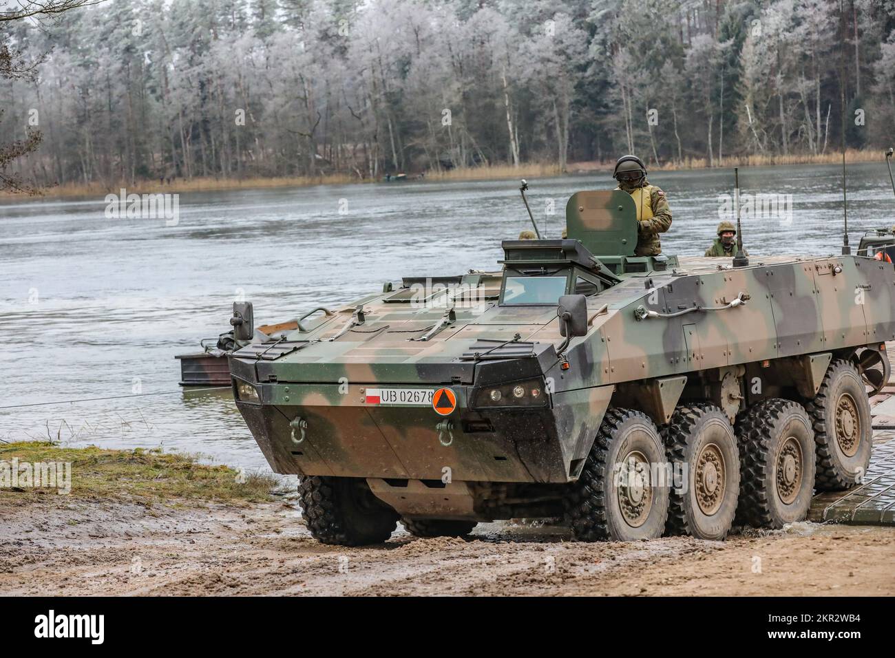 Polish soldiers assigned to 20th Mechanized Brigade utilize a floating ...