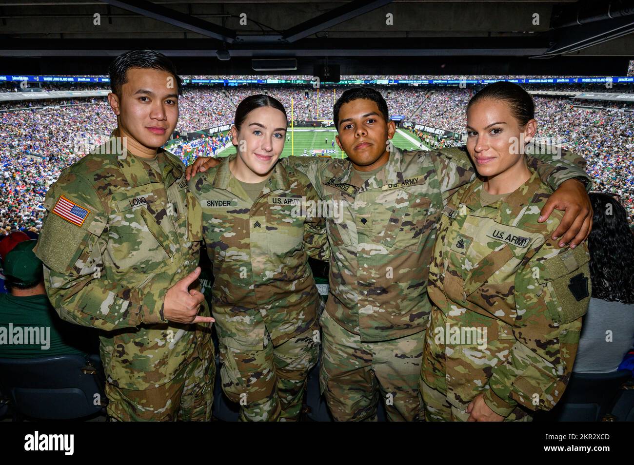 New Jersey National Guard Soldiers hold the American Flag along side ...
