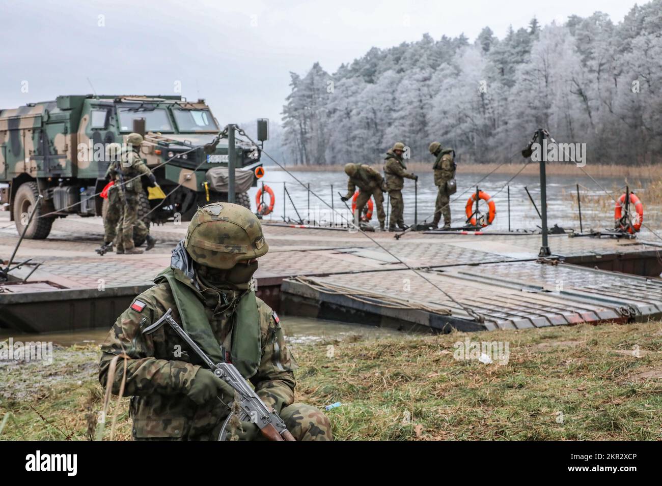 Polish soldiers assigned to 20th Mechanized Brigade utilize a floating ...
