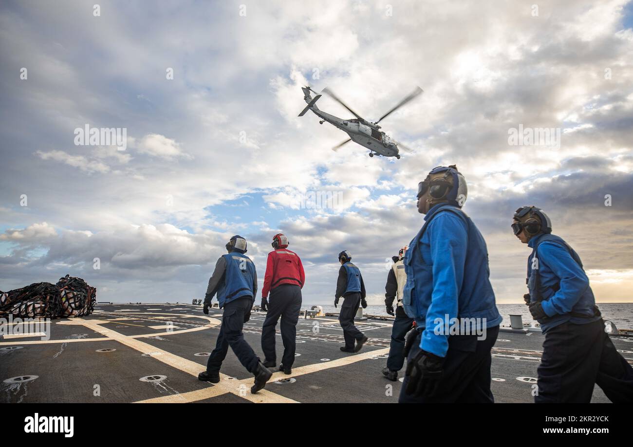 IONIAN SEA (Nov. 22, 2022) Sailors retrieve cargo delivered by an MH ...