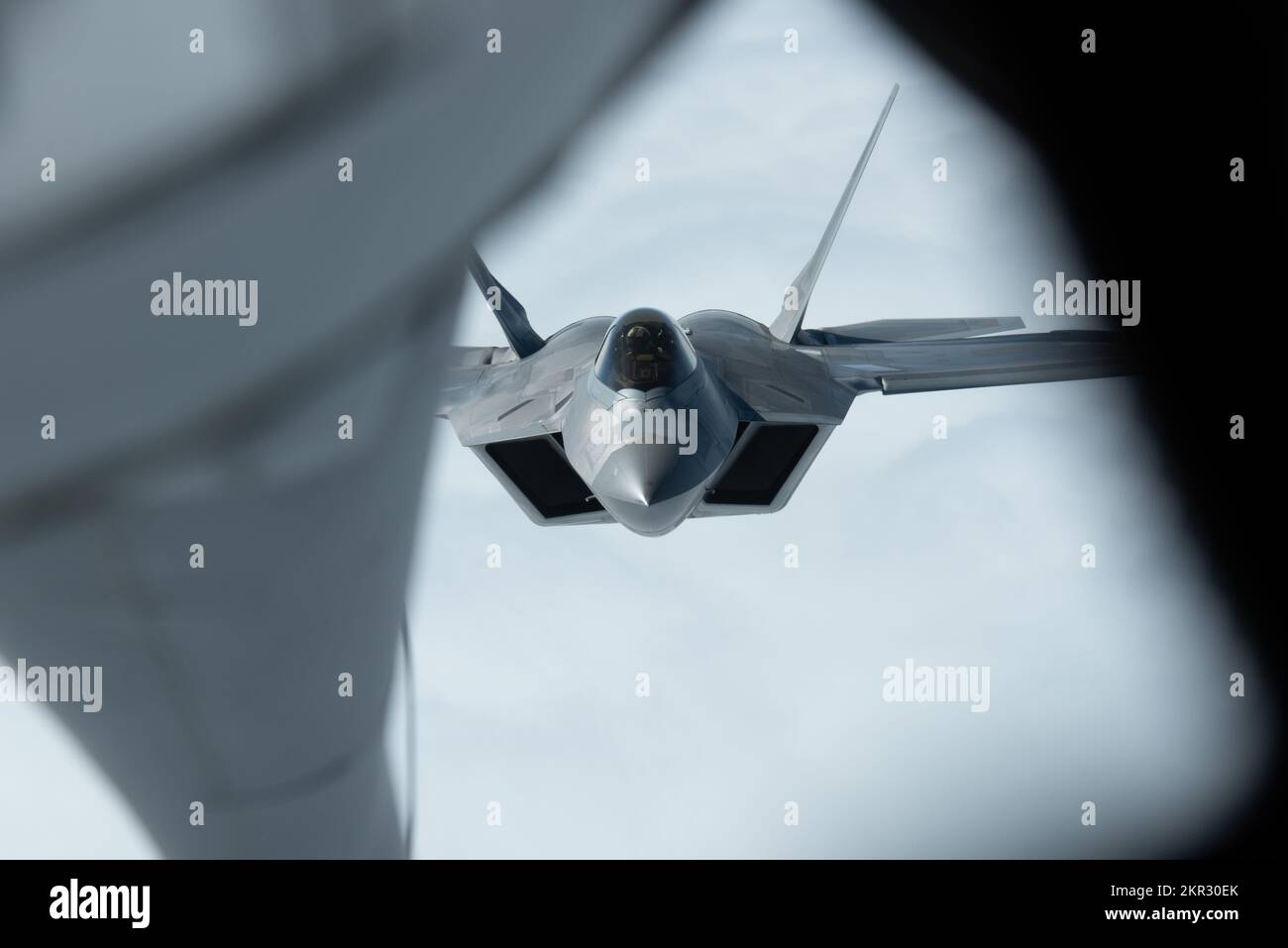 A U.S. Air Force F-22A Raptor assigned to the 3rd Wing, approaches a KC ...
