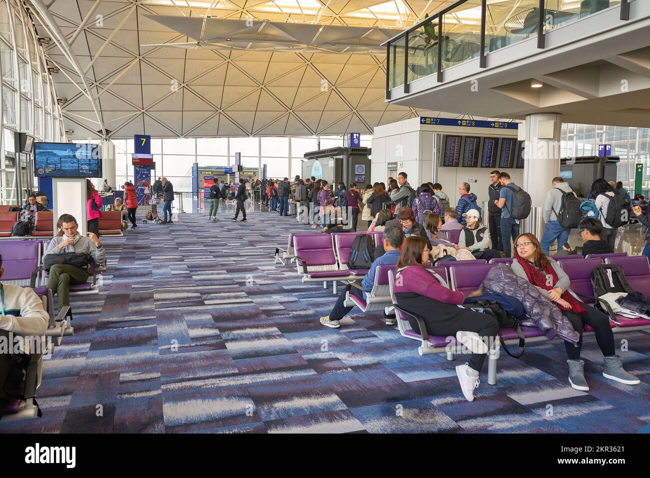 HONG KONG - CIRCA DECEMBER, 2019: people waiting at the departure gate ...
