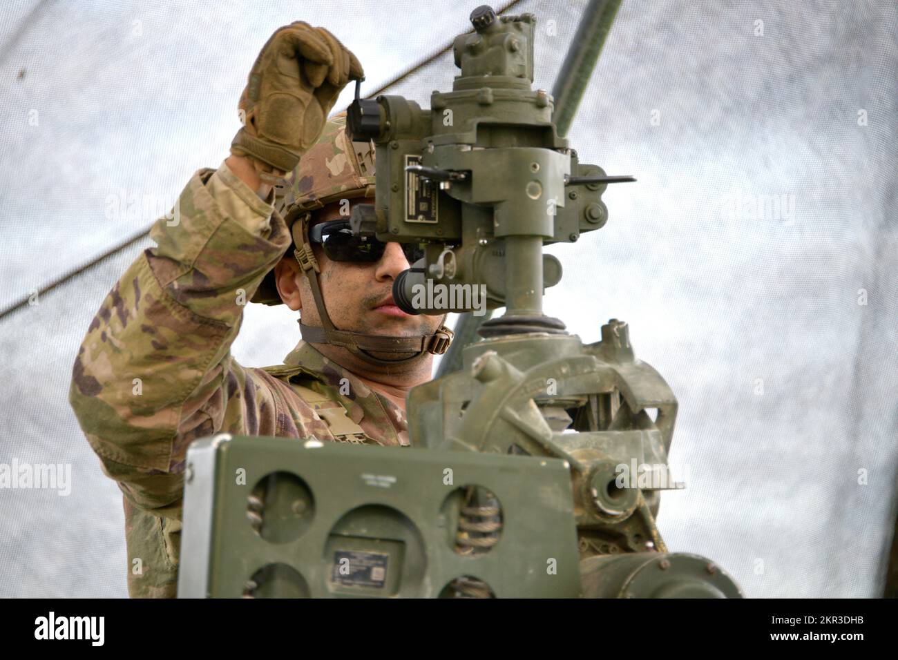 A U.S. Soldier assigned to C Battery, Field Artillery Squadron, 2nd Cavalry Regiment, sights in ...