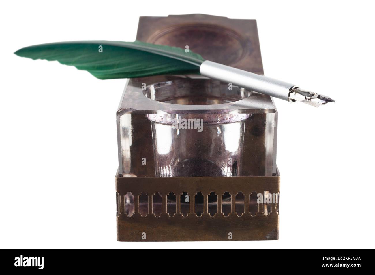 Antique vintage feather quill with glass inkwell isolated on white ...