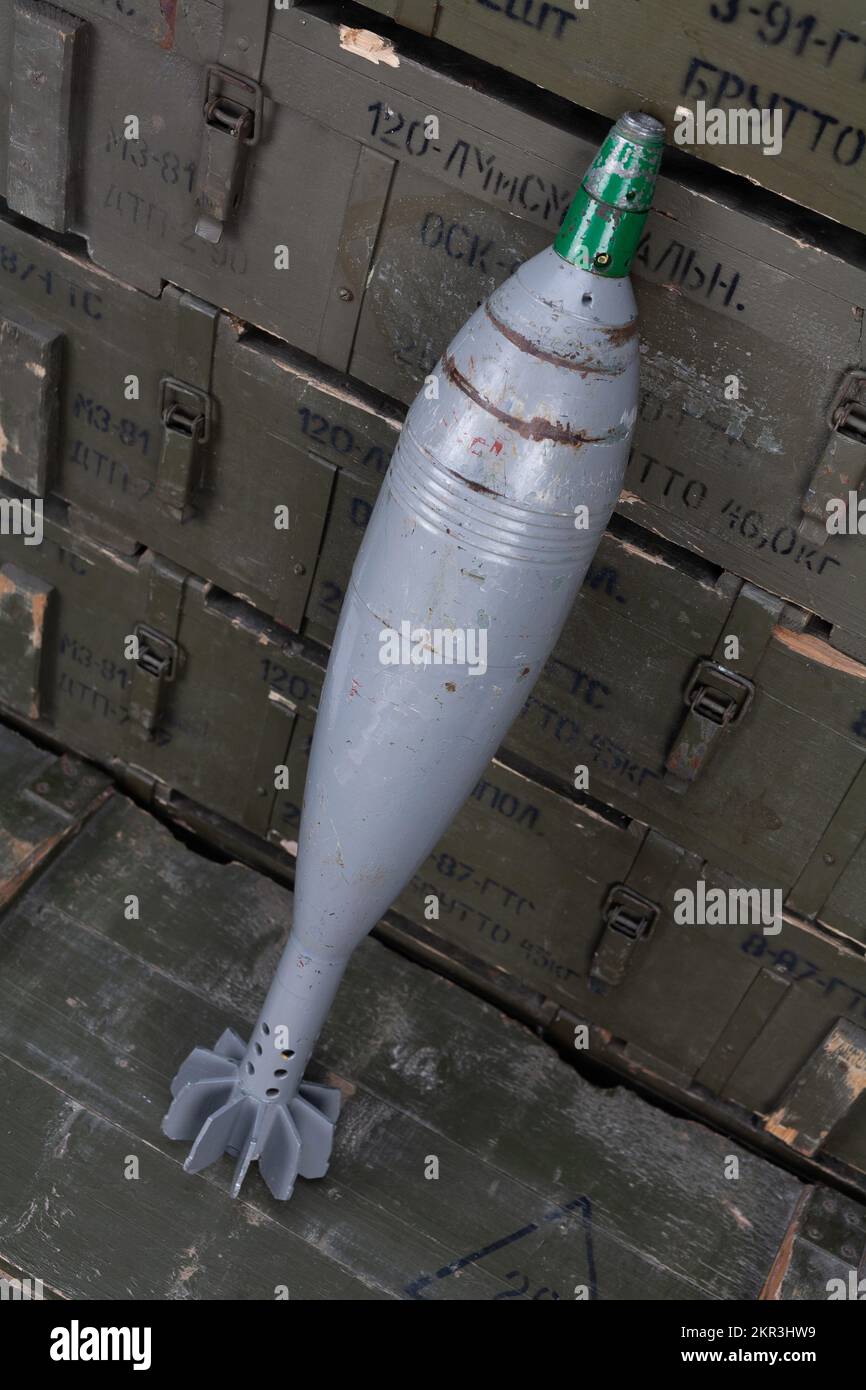120 mm caliber mortar shell on army green crate. Text in russian - type ...