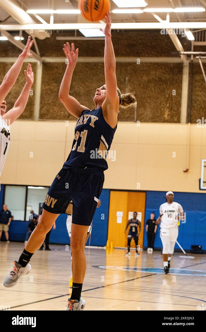 U.S. Navy Lt. Cmdr. Whitney Buffin, a member of team Navy, shoots a ...
