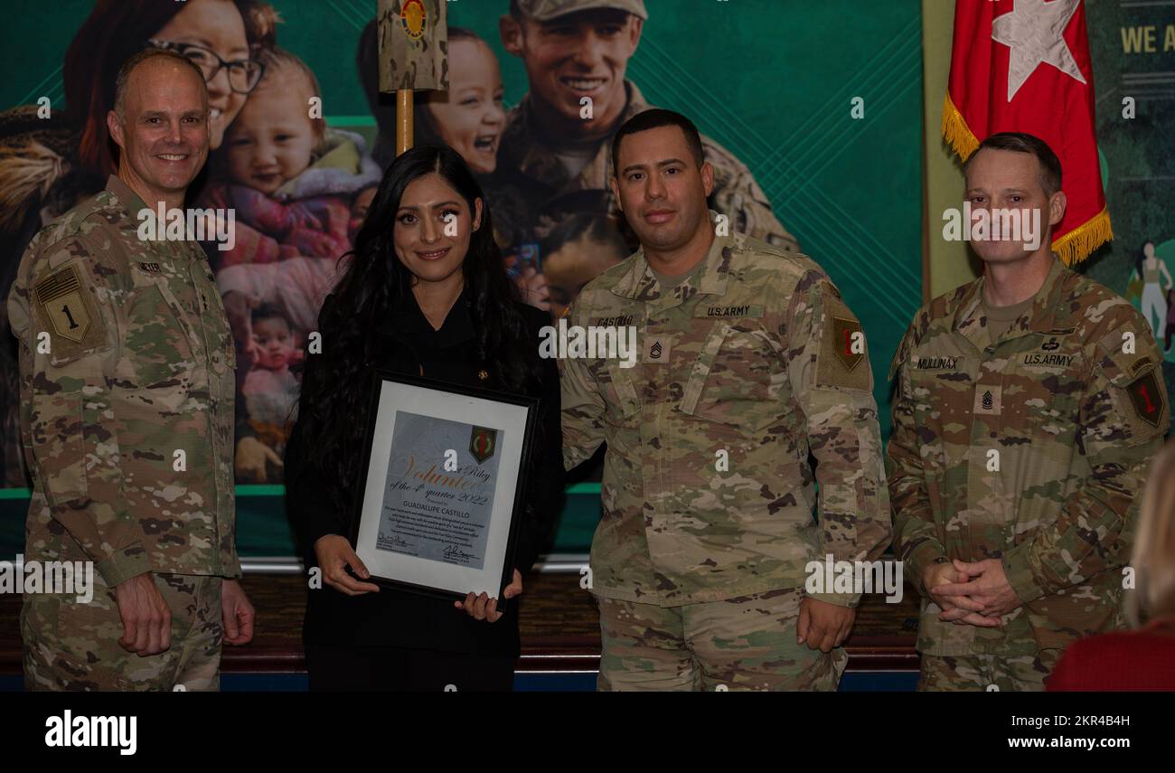 Guadalupe Castillo (middle left) receives a Volunteer of the Quarter ...