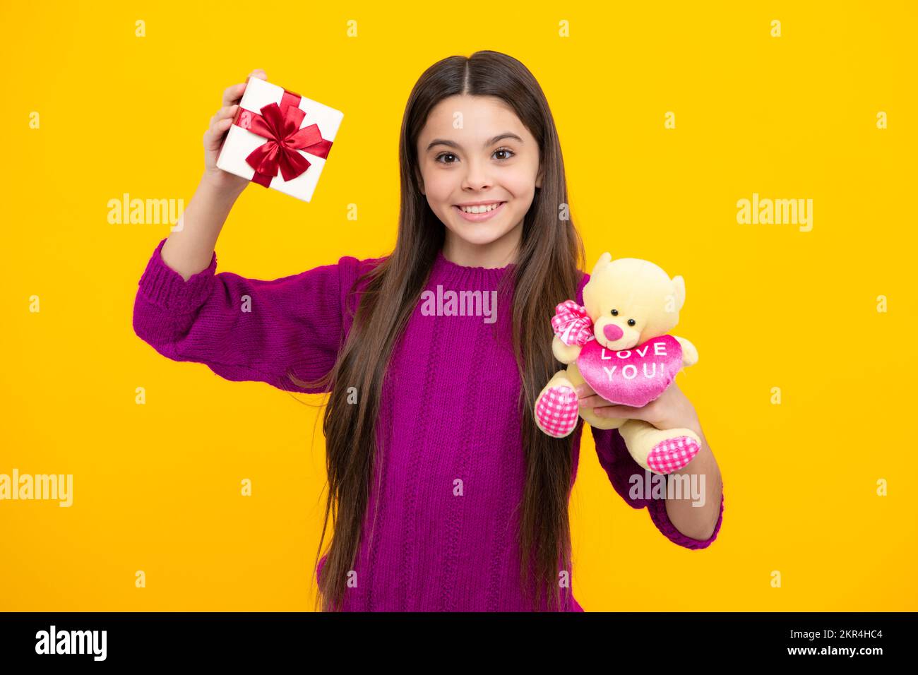 Teenager child with gift box, studio isolated background. Present for ...