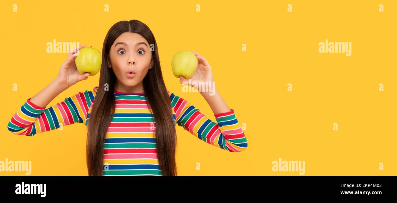 Apple a day is not enough. Surprised girl hold apples. Eating apple ...
