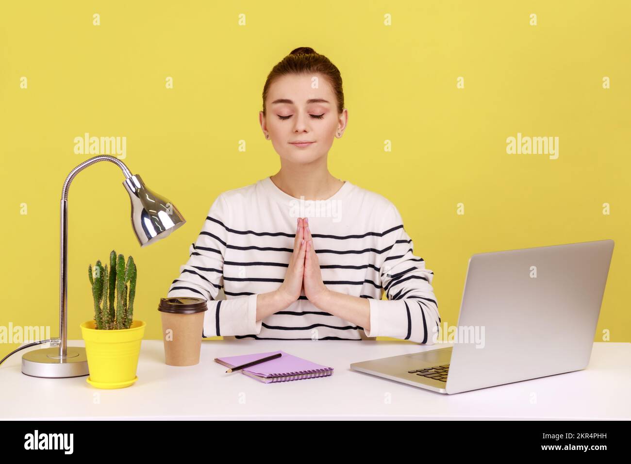 Open minded woman office worker in striped shirt pressing hands ...