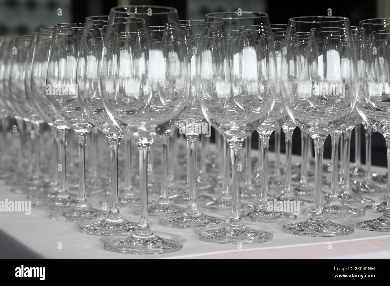 pile of empty wine glasses on table Stock Photo - Alamy