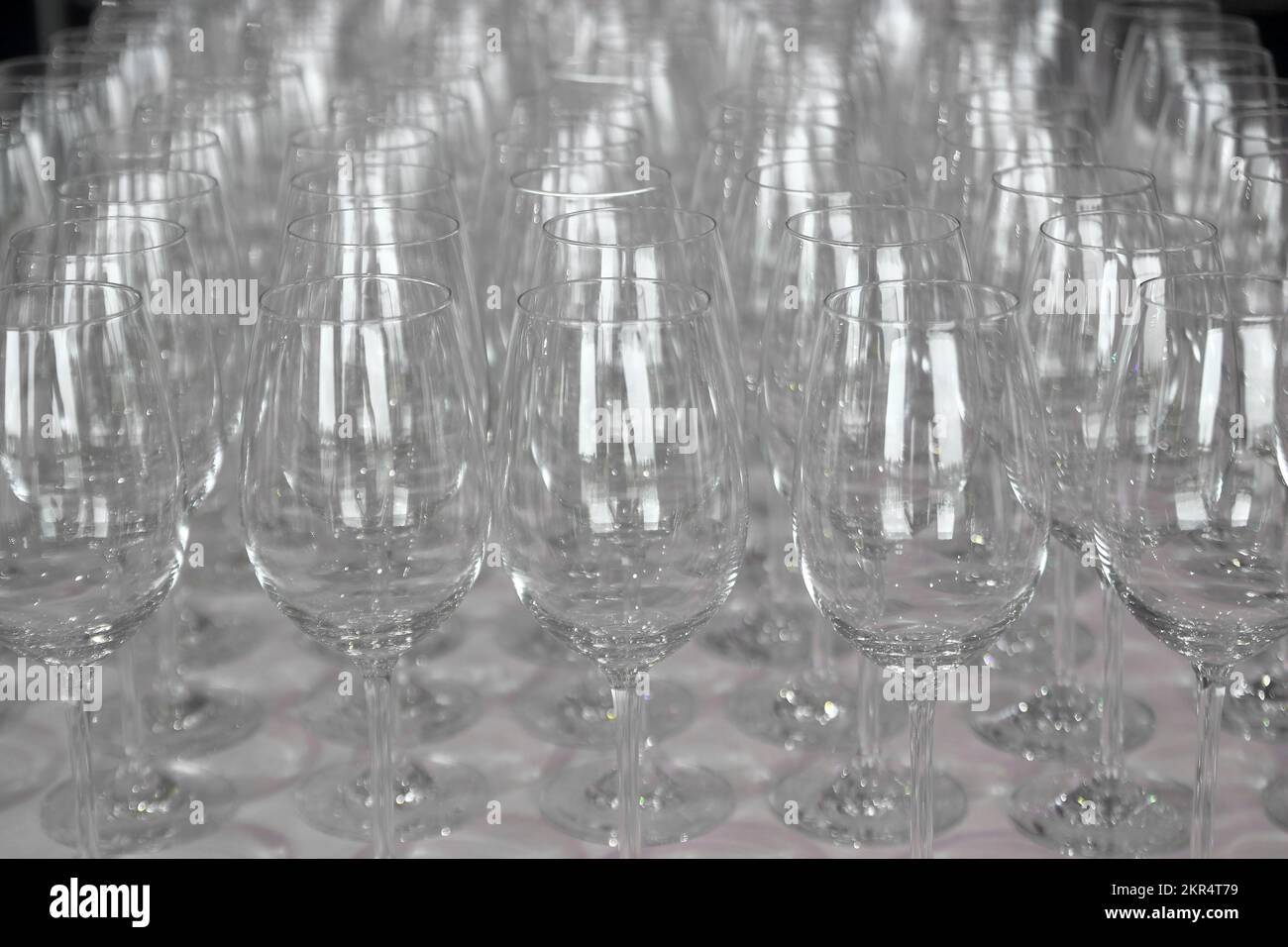 pile of empty wine glasses on table Stock Photo - Alamy