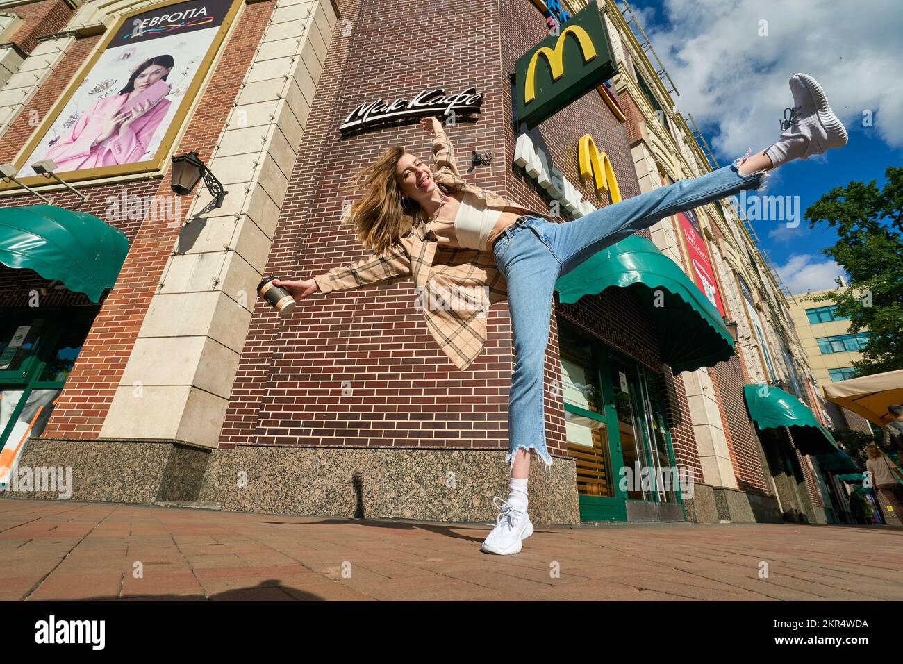 KALININGRAD, RUSSIA - CIRCA JULY, 2022: woman with paper cup show her ...