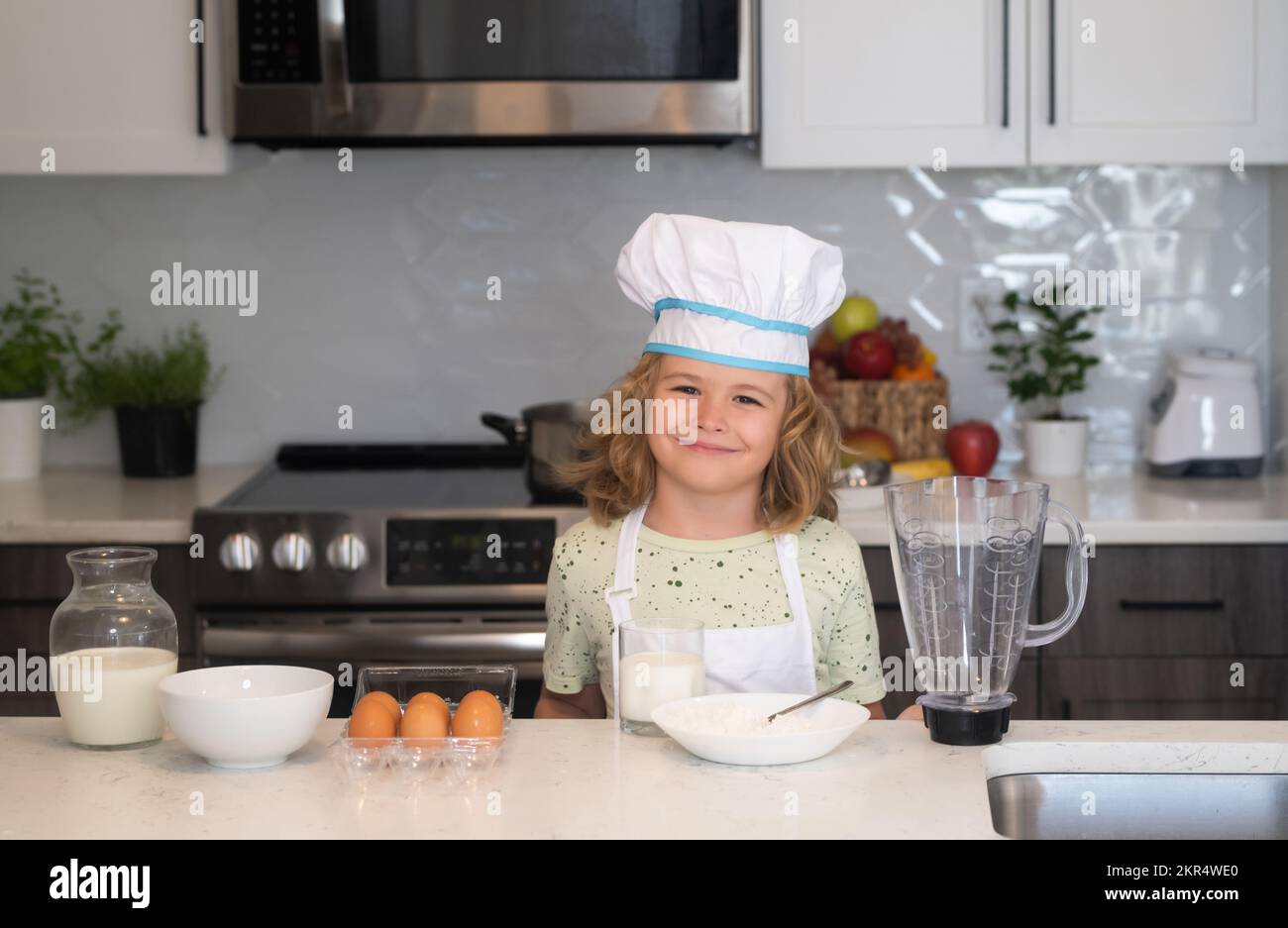 Funny little kid chef cook wearing uniform cook cap and apron cooked ...