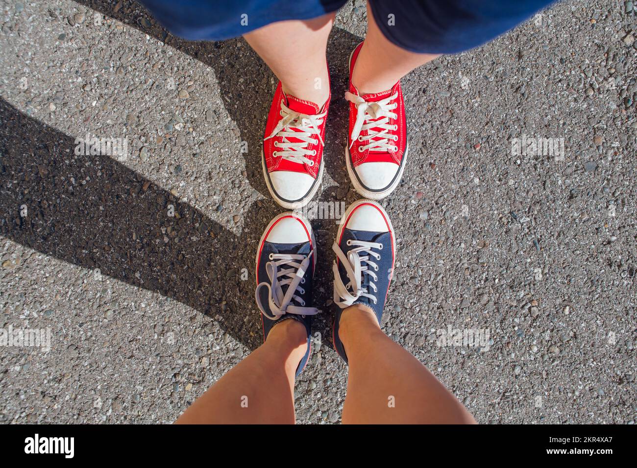 Red and blue sneakers shoes on a feet. Sneakers shoes Couple. Top view ...