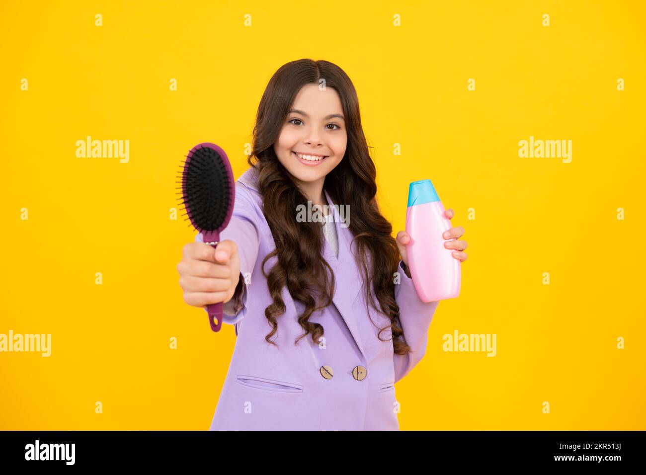 Child teen girl with shampoos conditioners and shower gel. Long hair ...