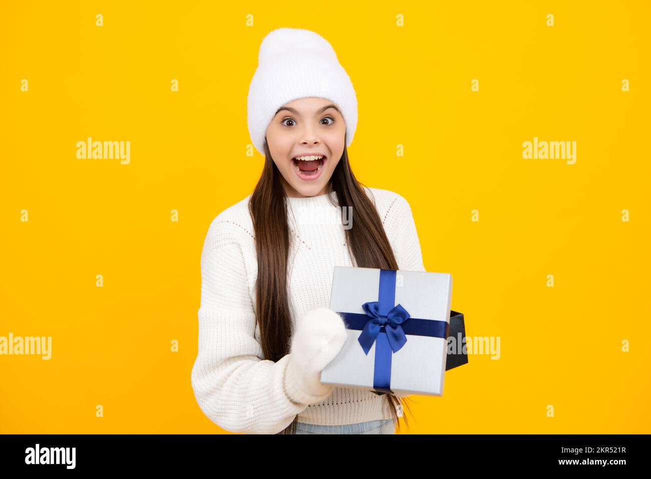 New Year or Christmas holiday gift. Portrait of a teenager child girl ...