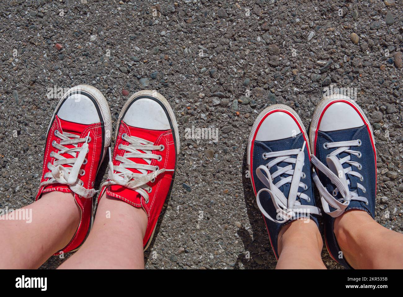 Red and blue sneakers shoes on a feet. Sneakers shoes Couple. Top view ...