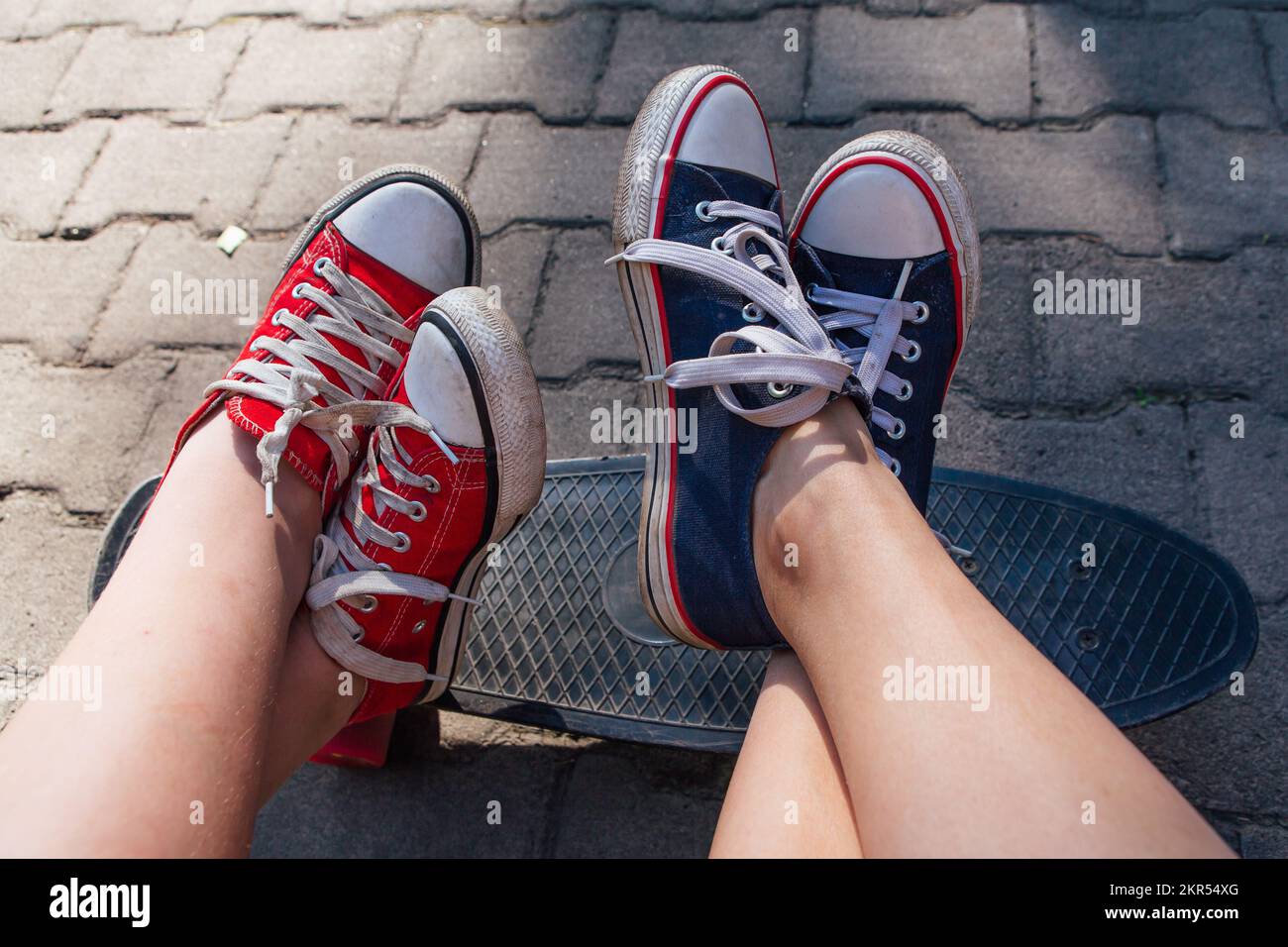 Red and blue sneakers shoes on a feet. Sneakers shoes Couple. Copy ...