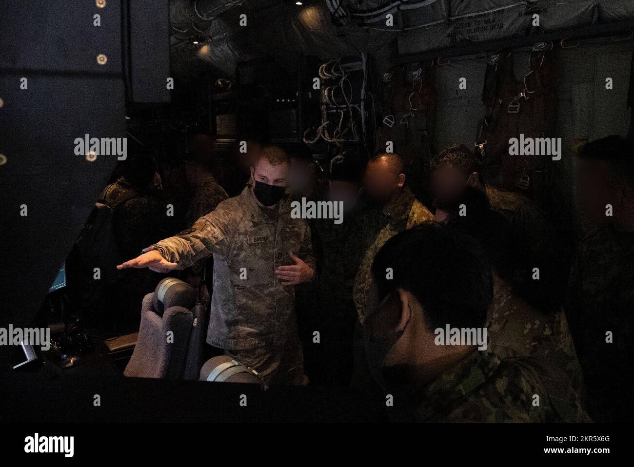 U.S Air Force Captain Timothy Bouska demonstrates the different ...