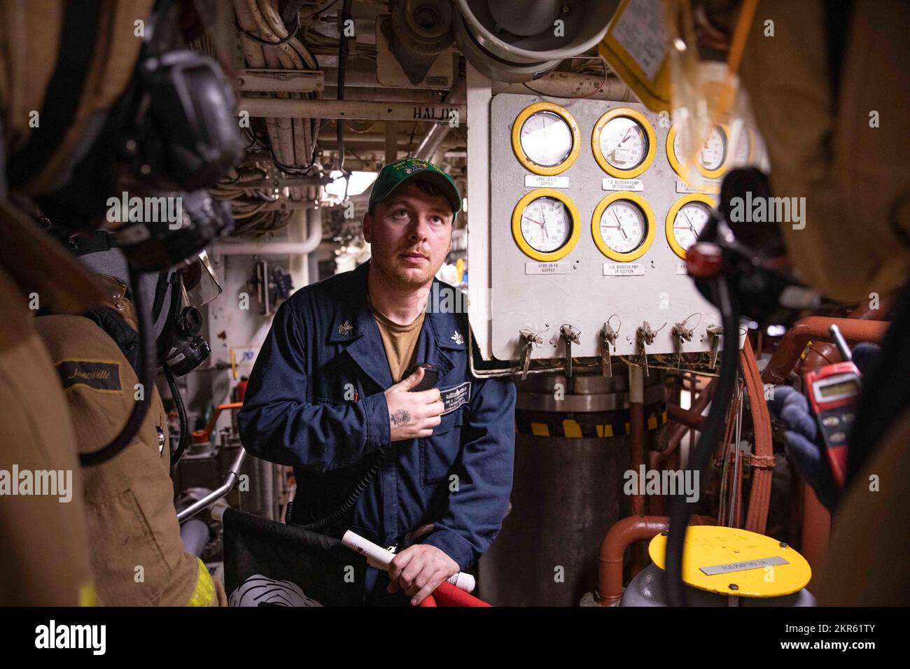 Machinist’s Mate 1st Class Andrew Crosswhite, center, monitors Sailors ...