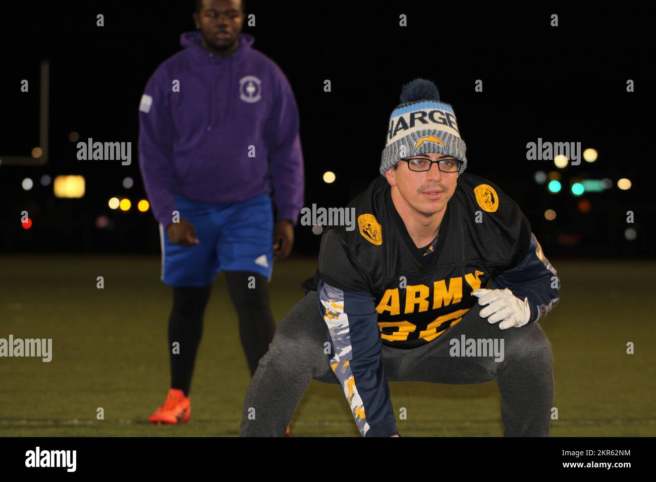 Marcos Torres, 1st Special Forces Group, snaps the ball to Tyrone Allen ...