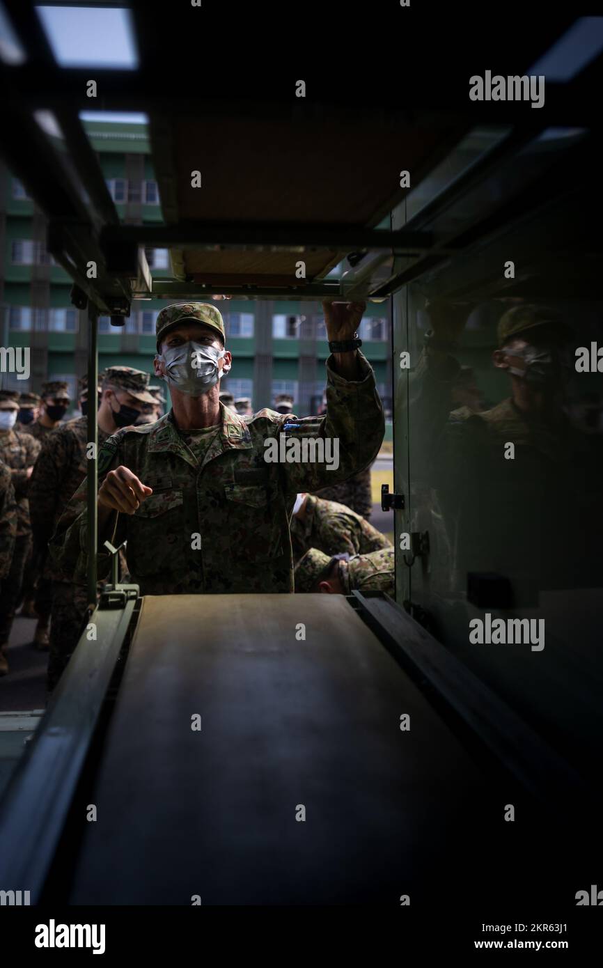 A Japan Ground Self-Defense Force member demonstrates features of a ...