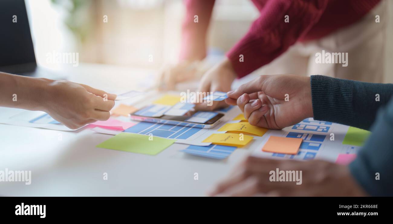 Group of UX UI or designers working to create content of mobile ...