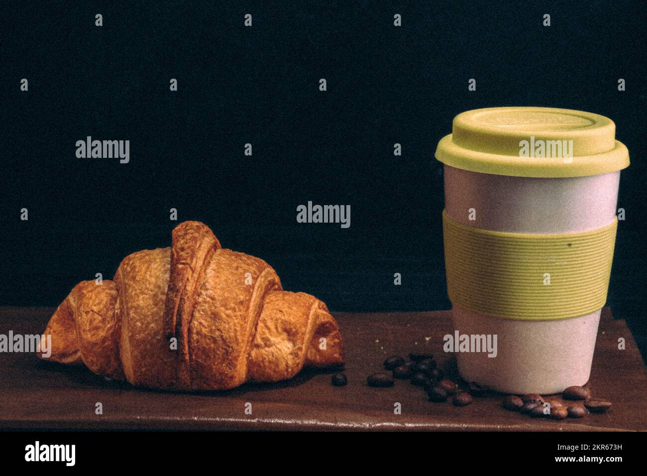 croissant with a mug of coffee. retro style grain effect Stock Photo ...