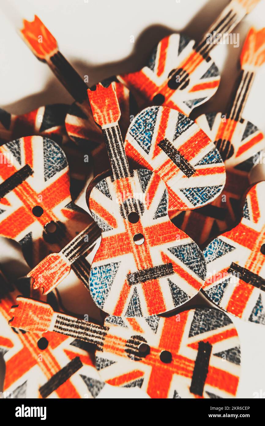 Old-fashioned still life photograph on a heap of union jack guitars in ...