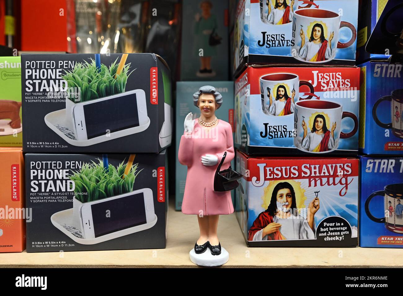 A vendor displays a model of the late Queen Elizabeth at his stall set ...
