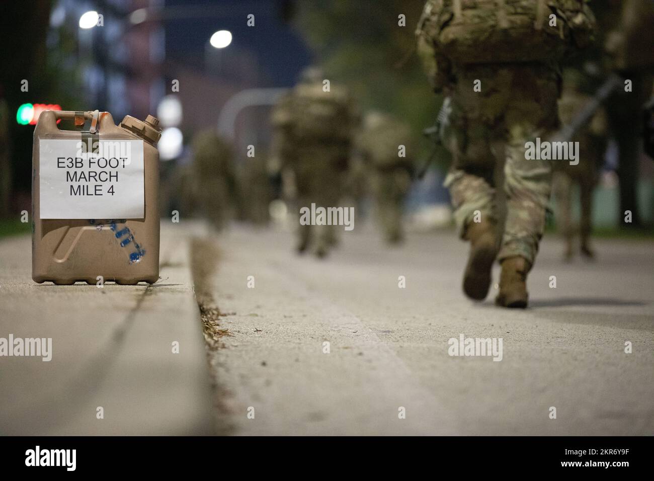 Soldiers pass the 4-mile marker during a 12-mile ruck march on Caserma ...