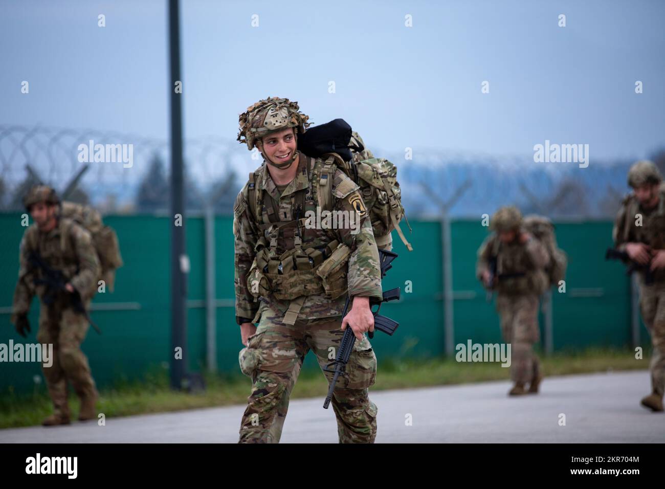 A paratrooper in the 173rd Airborne Brigade nears the finish of the 12 ...
