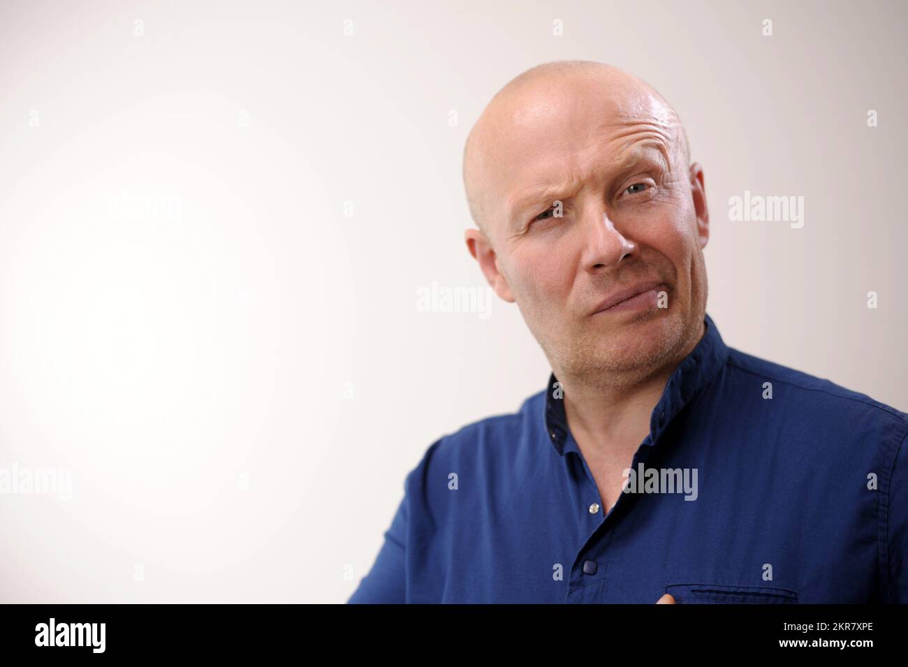 Emotions of an adult handsome bald man There was some kind of surprise ...