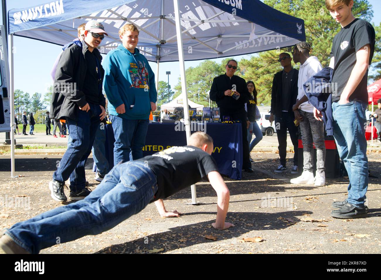 IS2 Scott counting the push-ups done by a student at the Navy Tent at ...