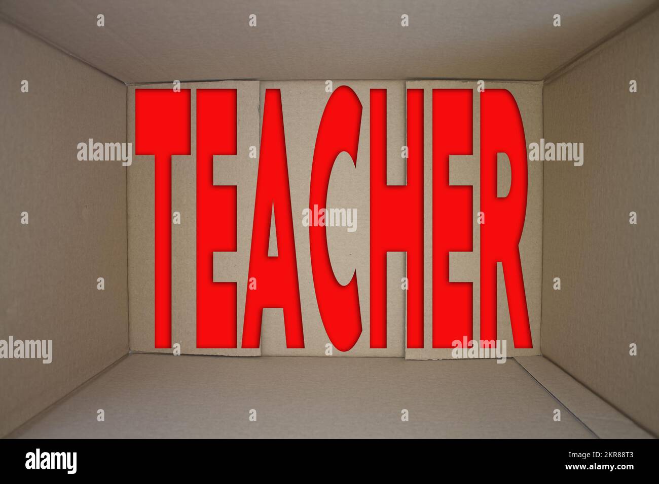 Teacher word with cardboard box. Brown folded card box Stock Photo - Alamy