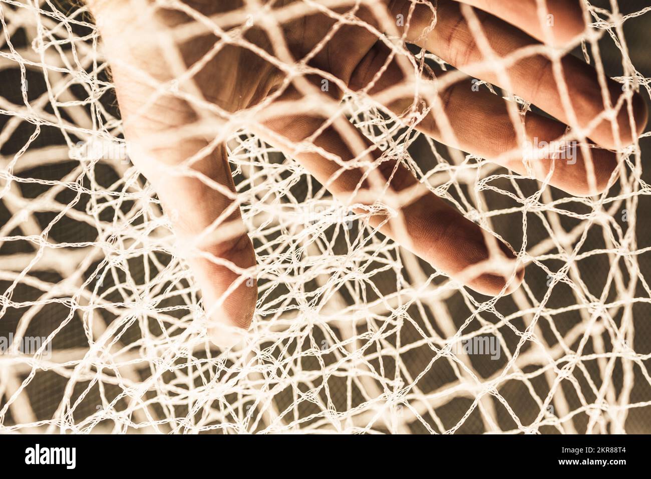 Net man caught trap hi-res stock photography and images - Alamy