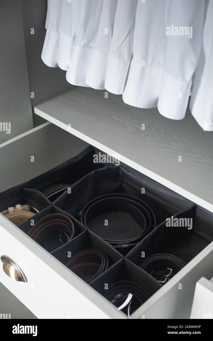 Male wardrobe closet open dresser drawer leather belt storage ...
