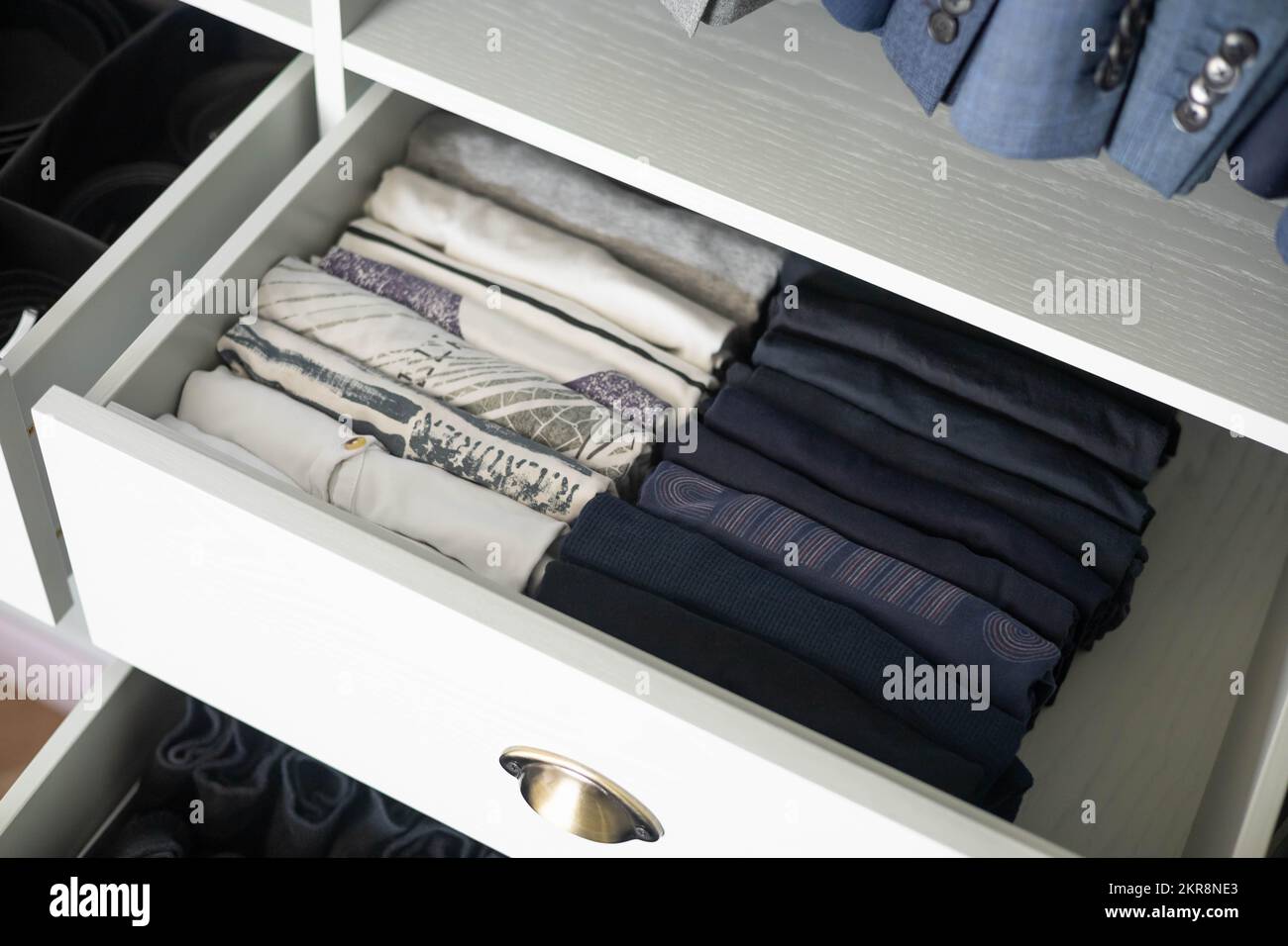 Open wardrobe folded clothes hi-res stock photography and images - Alamy