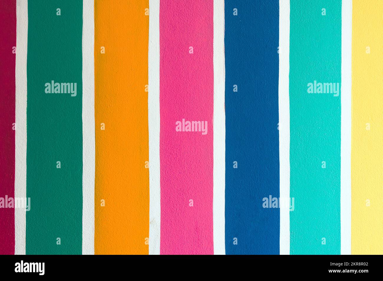 Multicolor vertical striped pattern on cement wall. Colorful painted on ...