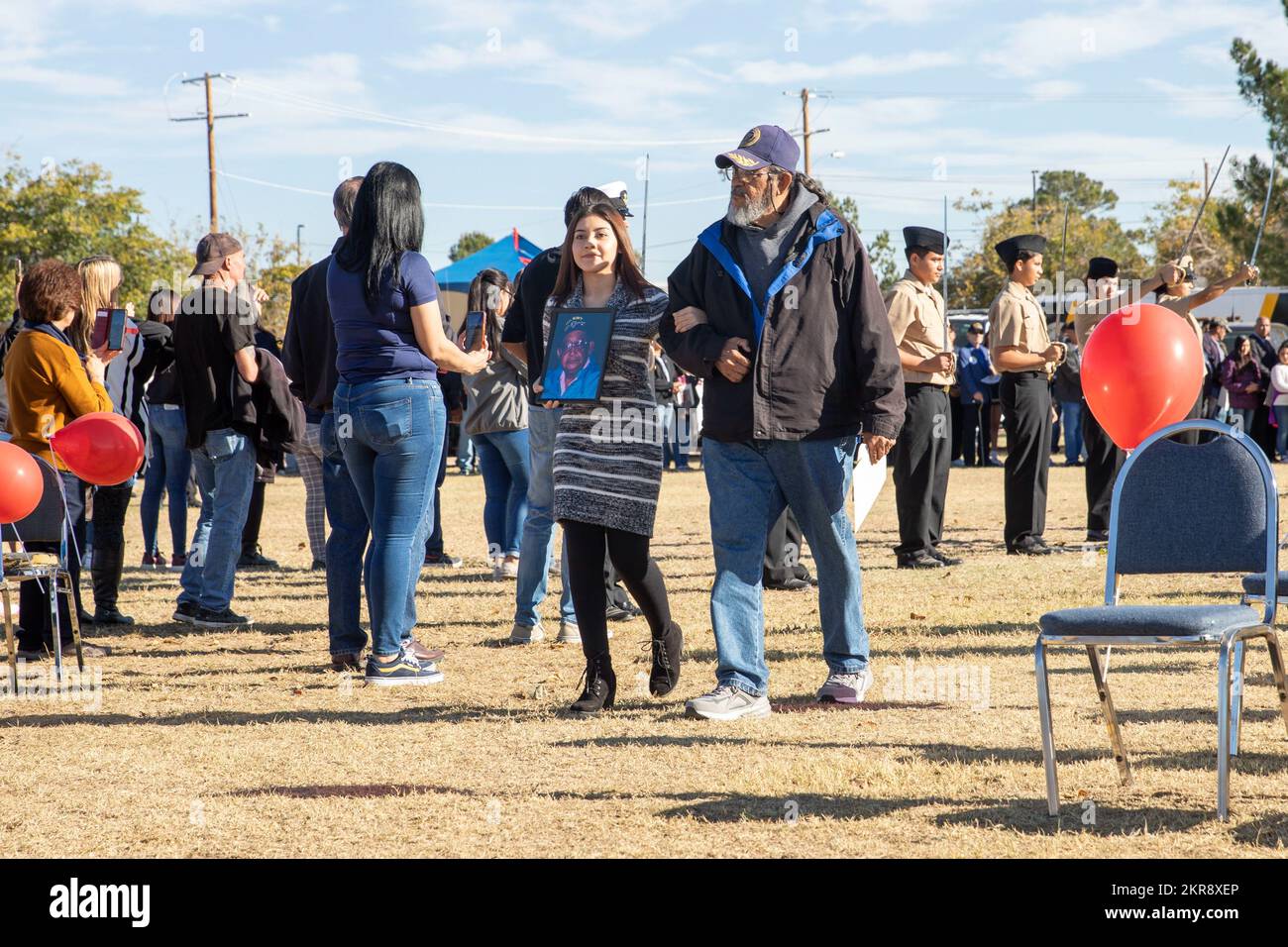 A local high school student escorts a veteran to his seat during Fabens ...