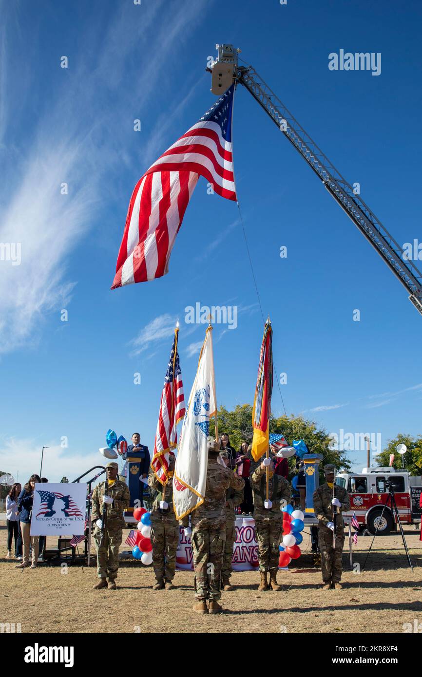 Members of the 1st Armored Division color guard present arms during the ...