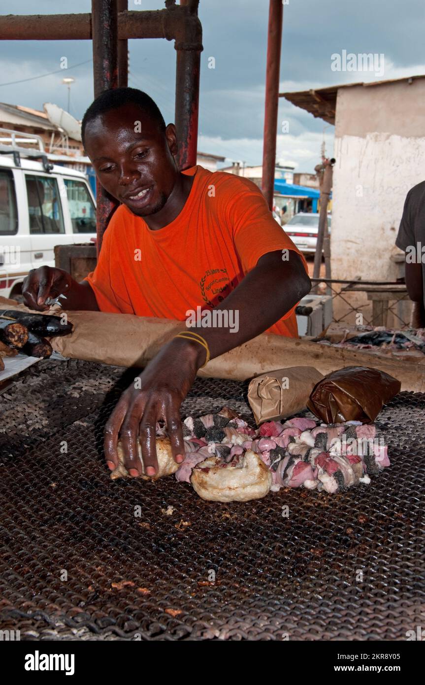 Preparing goat meat for mitchopo, Kamalondo; Katanga Province ...