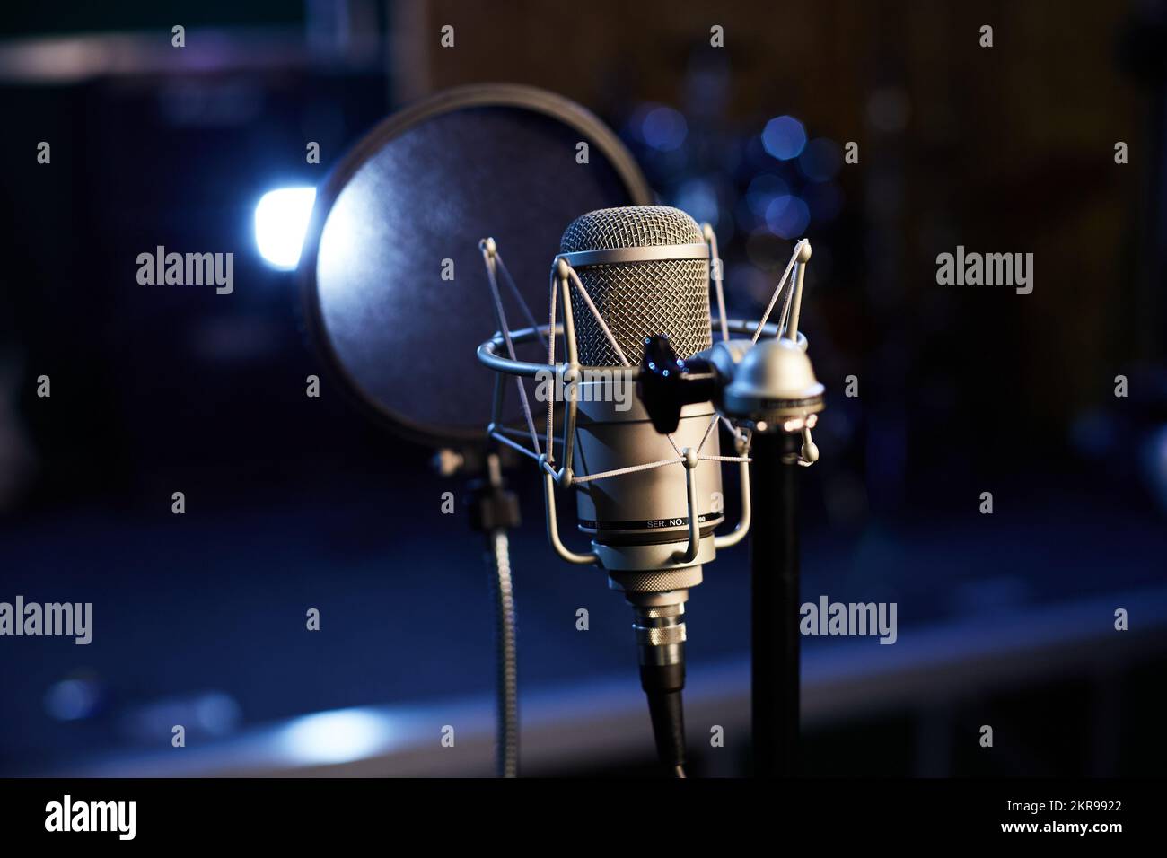 Microphone with a pop shield closeup on the background of a ...